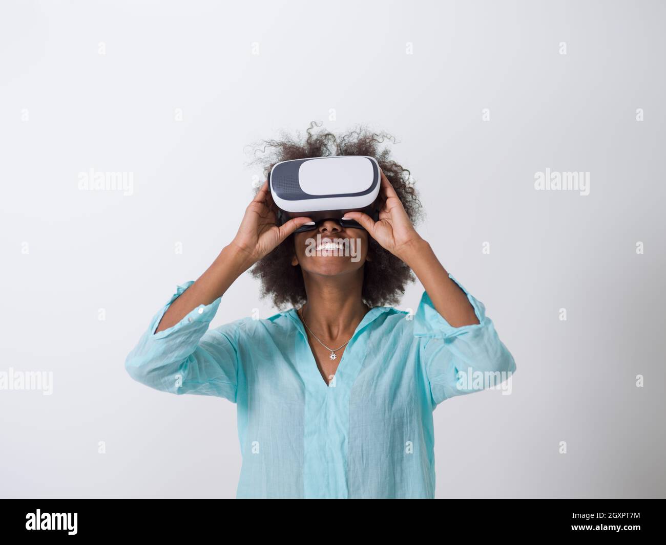 Happy african american girl getting experience using VR headset glasses ...