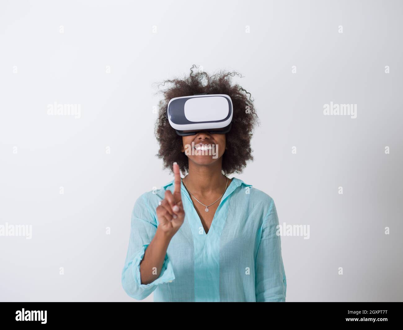 Happy african american girl getting experience using VR headset glasses ...