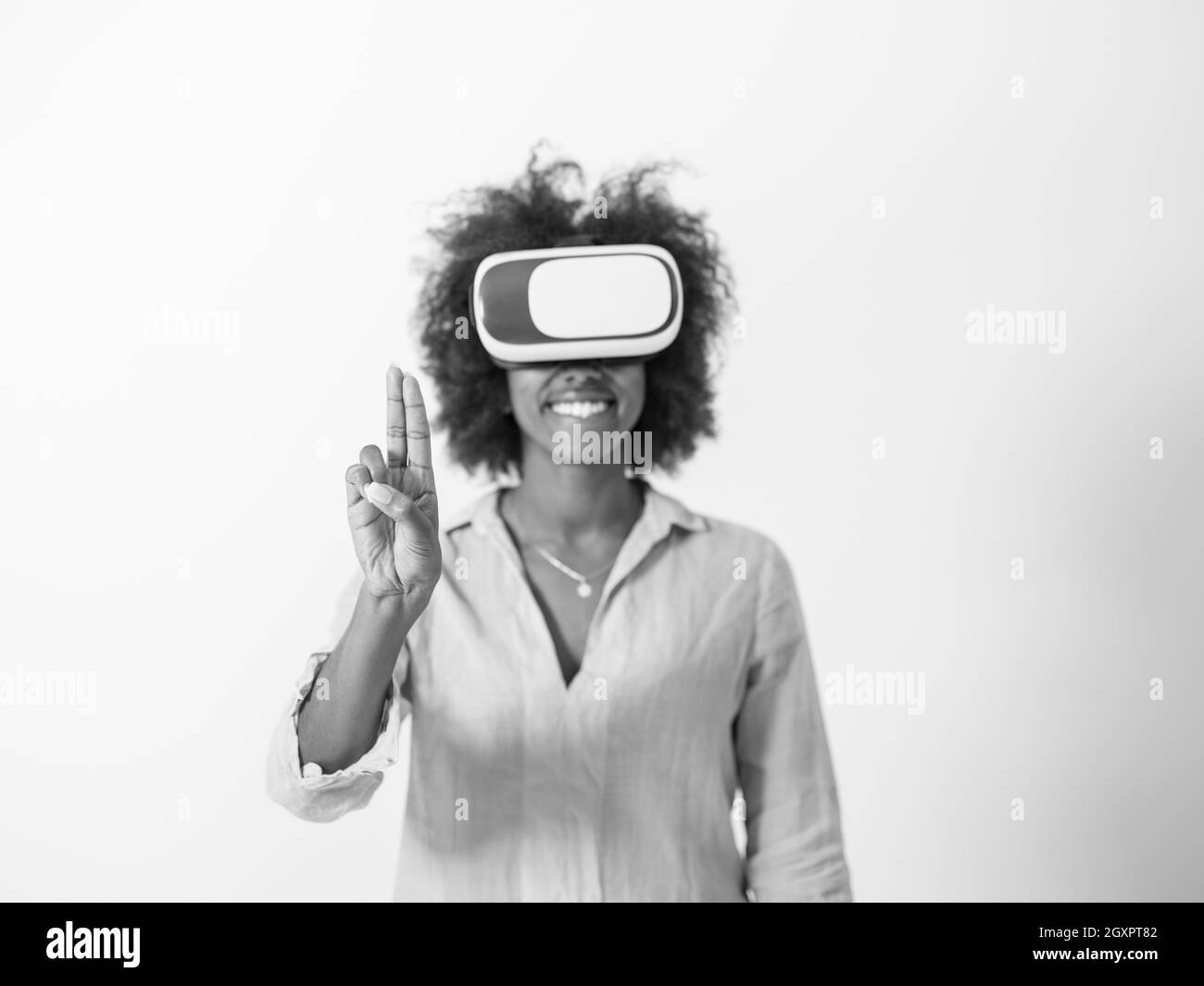 Happy african american girl getting experience using VR headset glasses ...