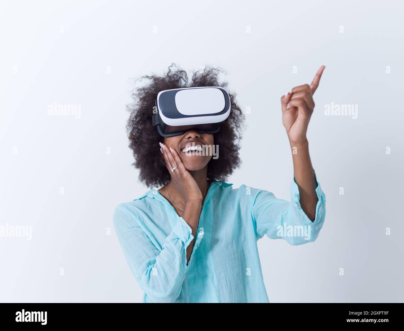 Happy african american girl getting experience using VR headset glasses ...