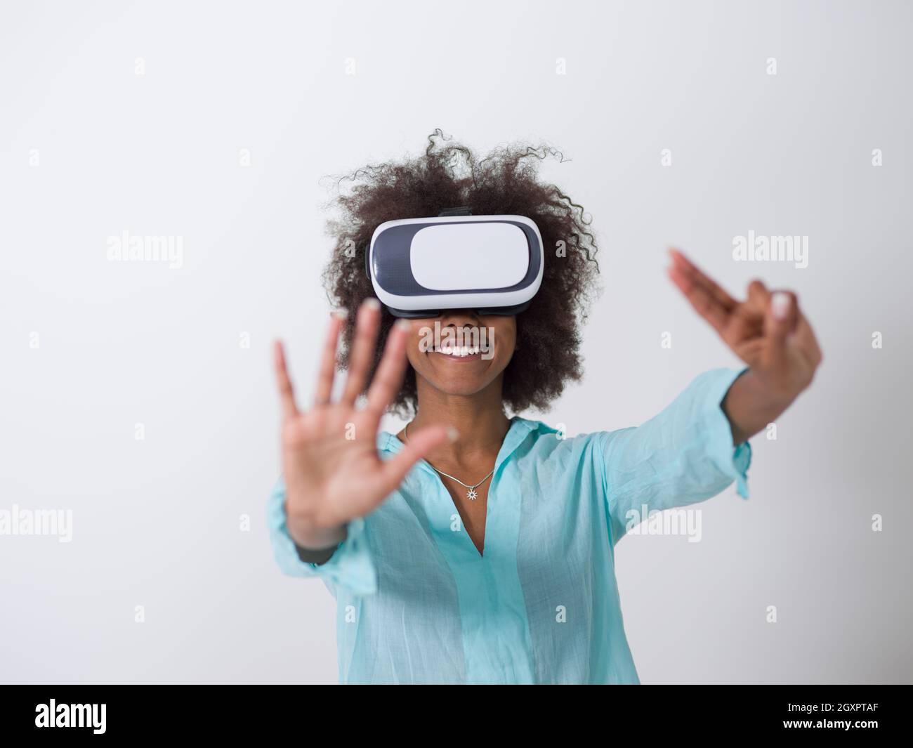 Happy african american girl getting experience using VR headset glasses ...