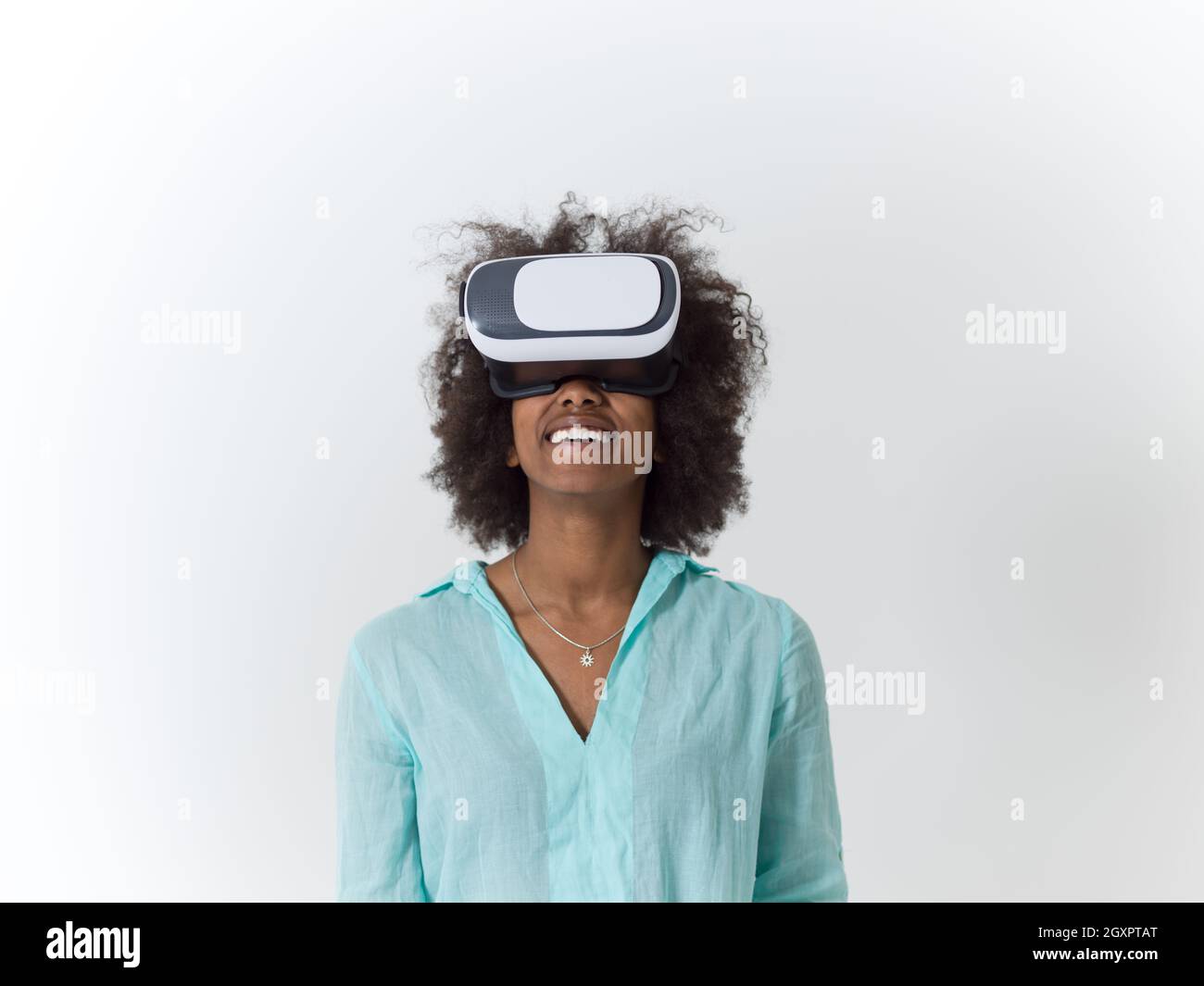 Happy african american girl getting experience using VR headset glasses ...