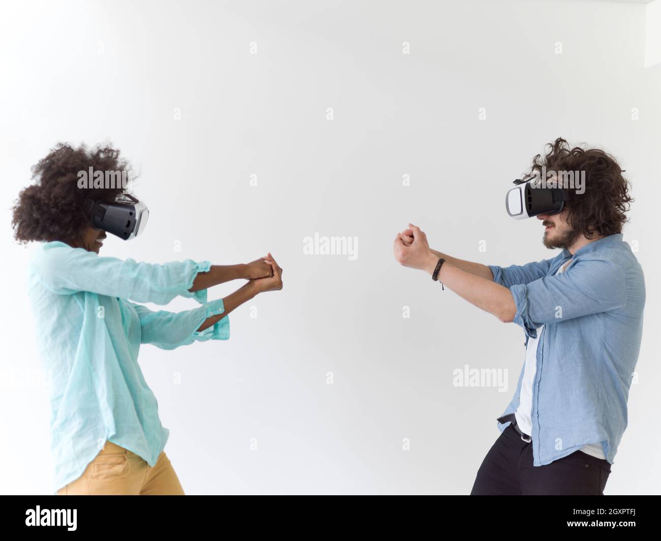 Happy multiethnic couple getting experience using VR headset glasses of ...