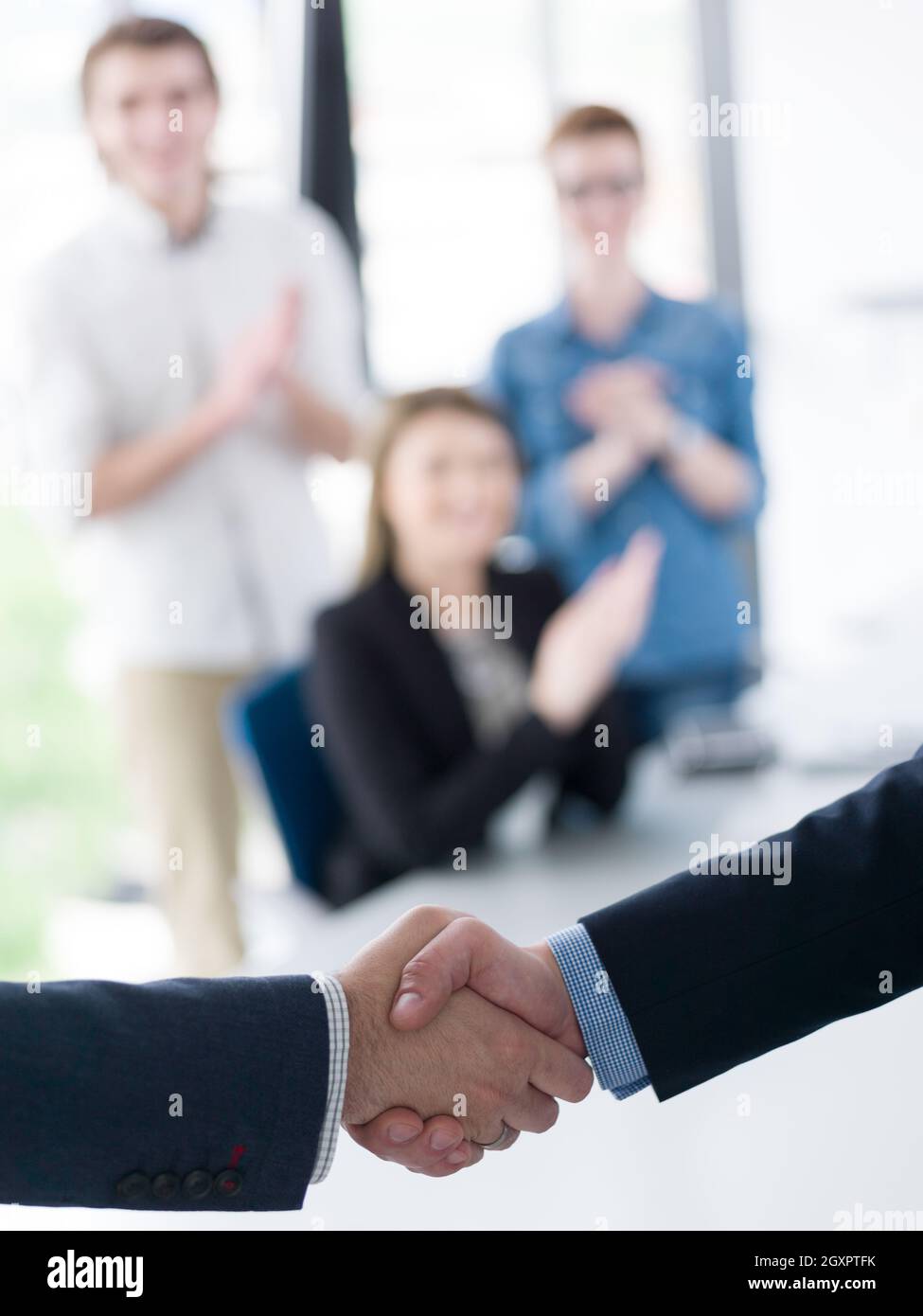 Business Partner Shake Hands on meetinig in modern office building ...