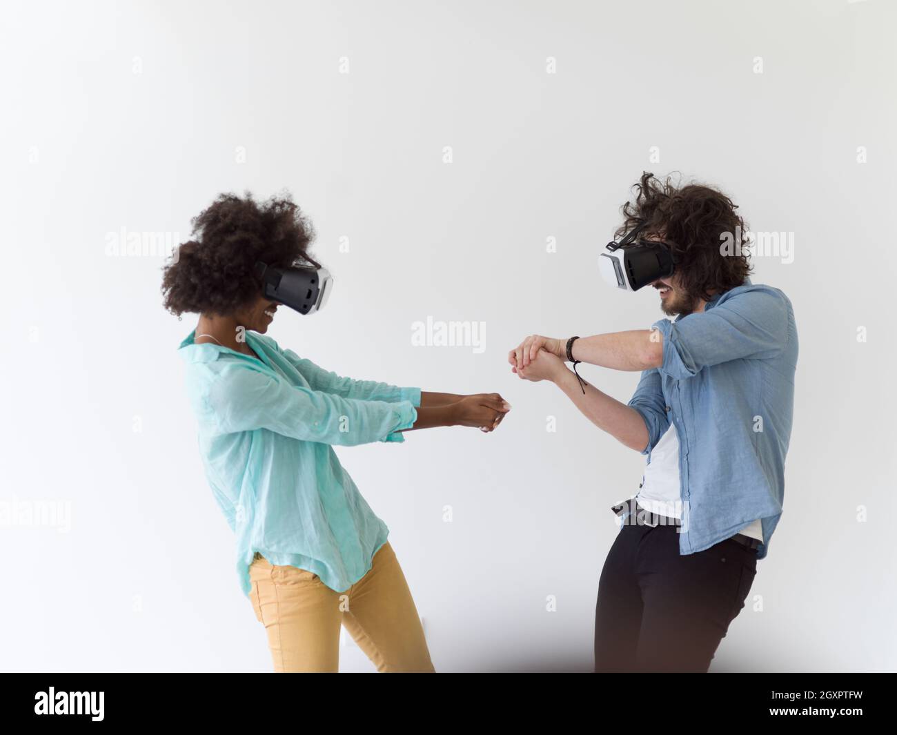 Happy multiethnic couple getting experience using VR headset glasses of ...