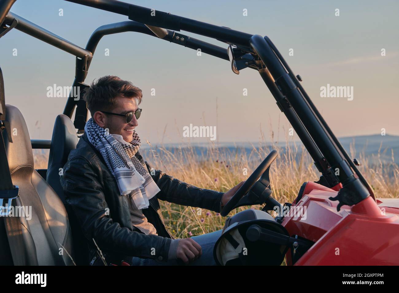 portrait of young happy excited man enjoying beautiful sunny day while ...