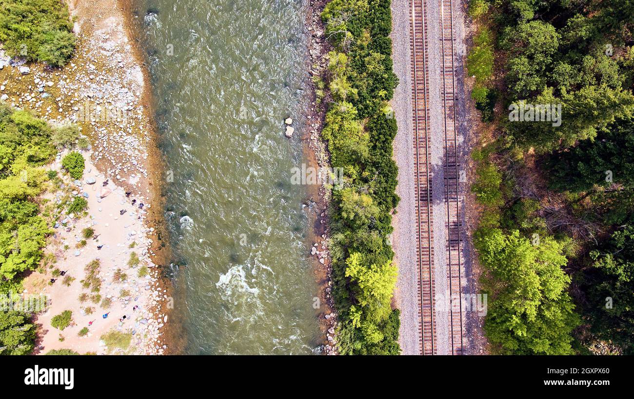 Aerial looking down on river and train tracks Stock Photo - Alamy