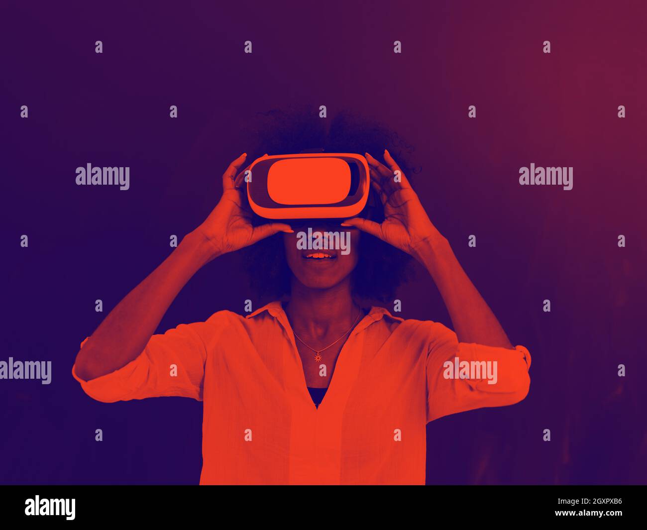 Happy african american girl getting experience using VR headset glasses ...