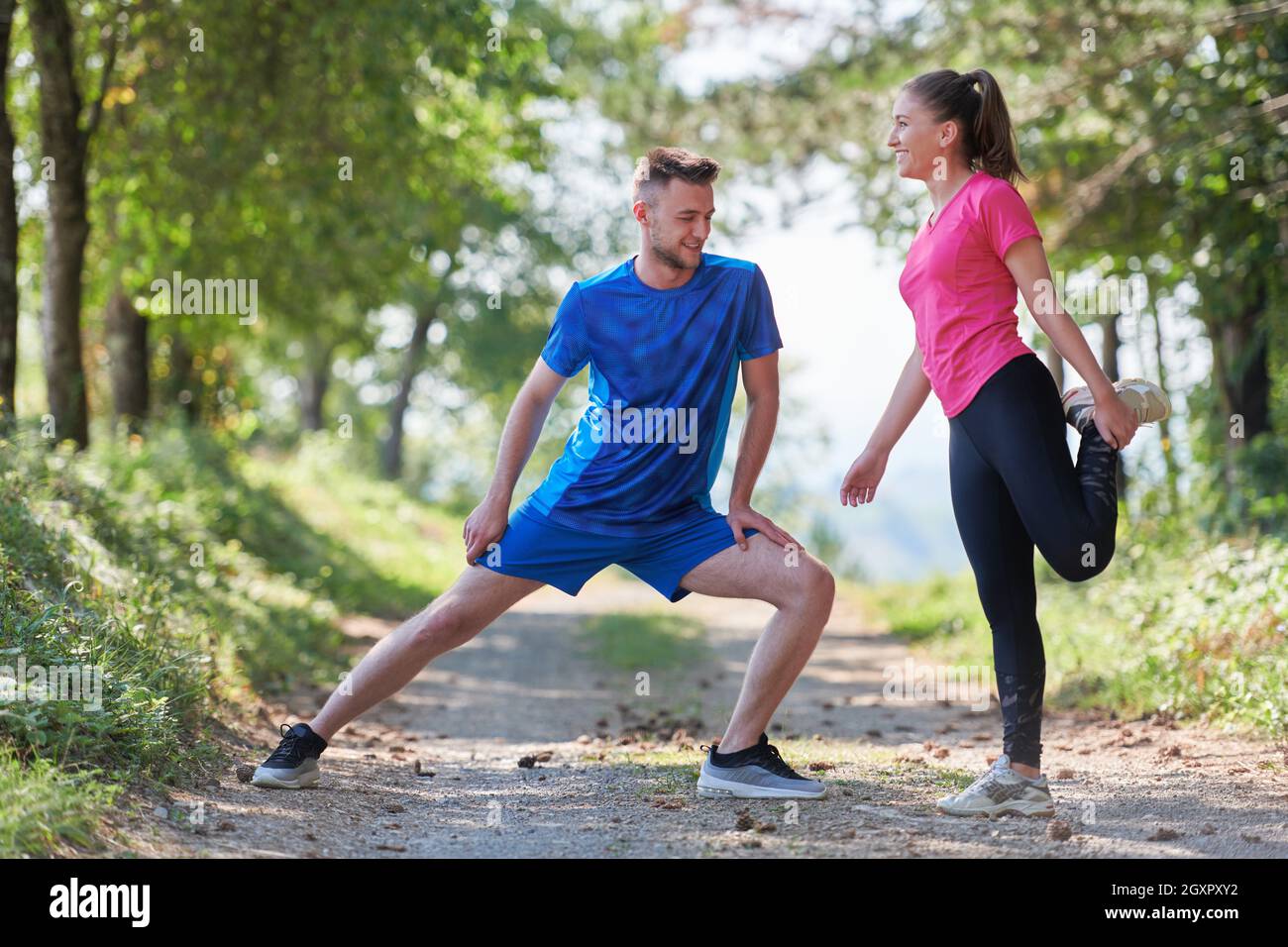 young happy couple enjoying in a healthy lifestyle warming up and ...