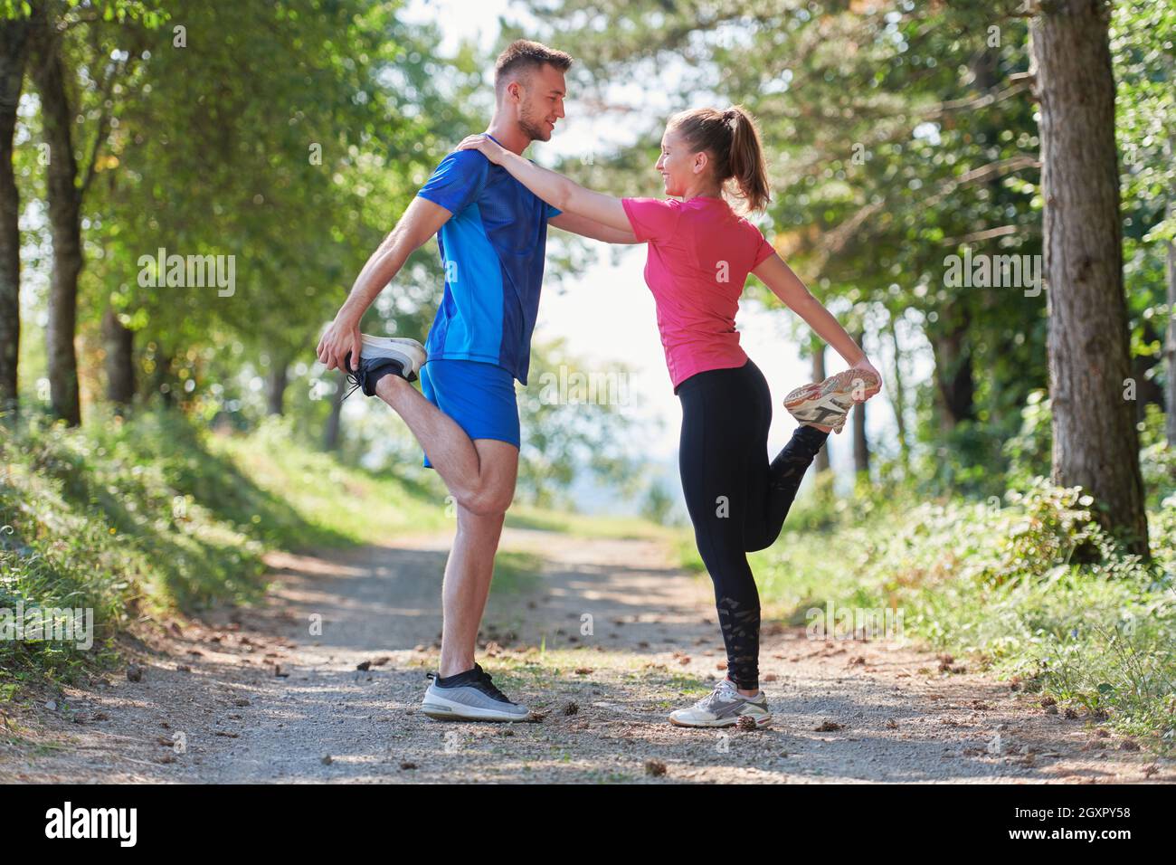 young happy couple enjoying in a healthy lifestyle warming up and ...