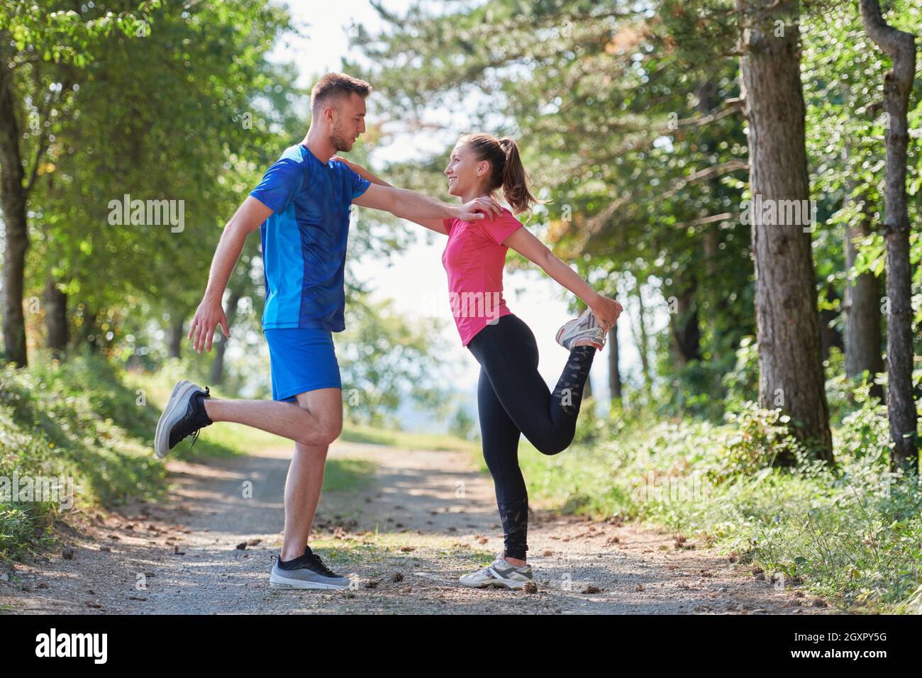 young happy couple enjoying in a healthy lifestyle warming up and ...