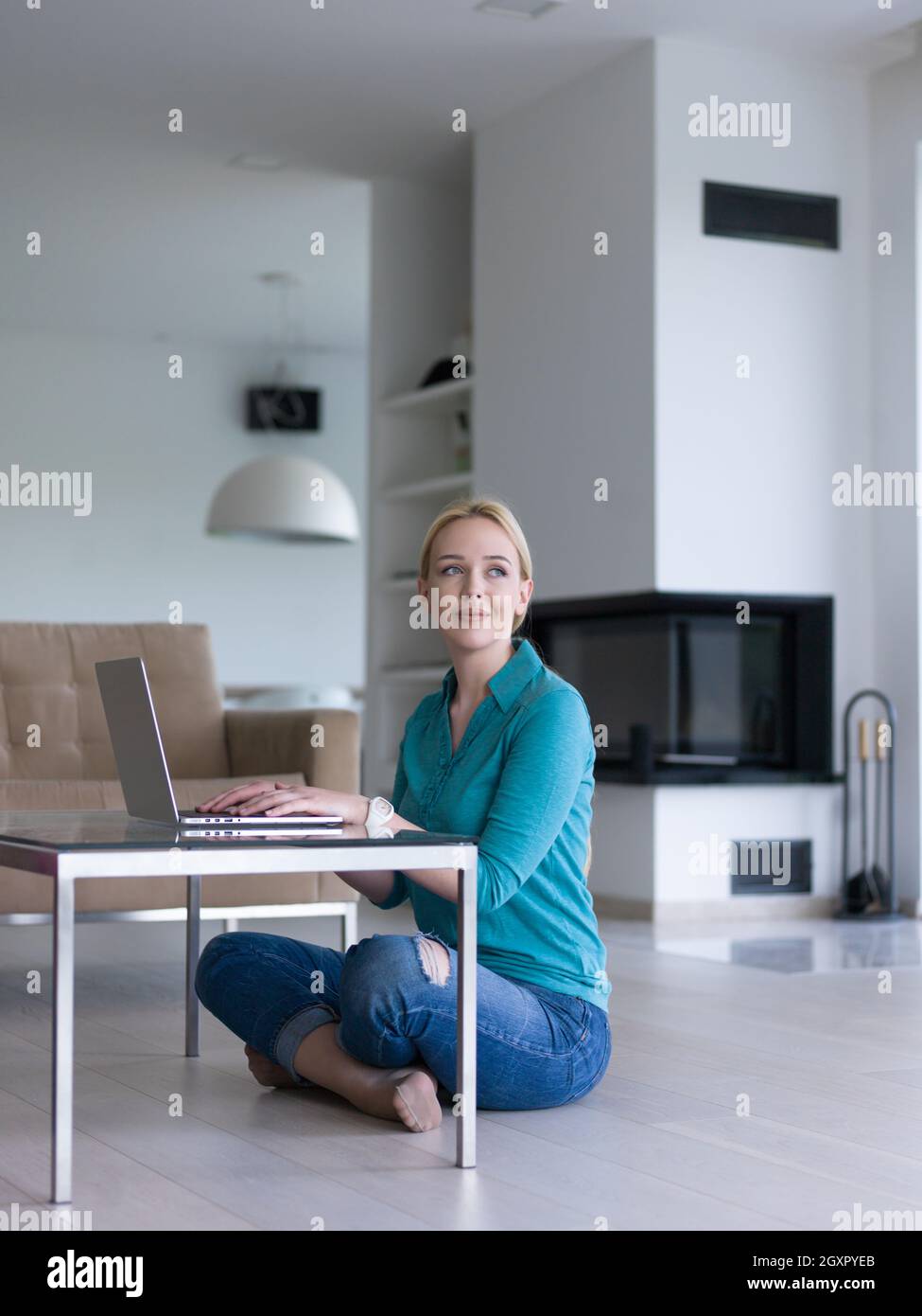beautiful young women using laptop computer on the floor of her luxury ...