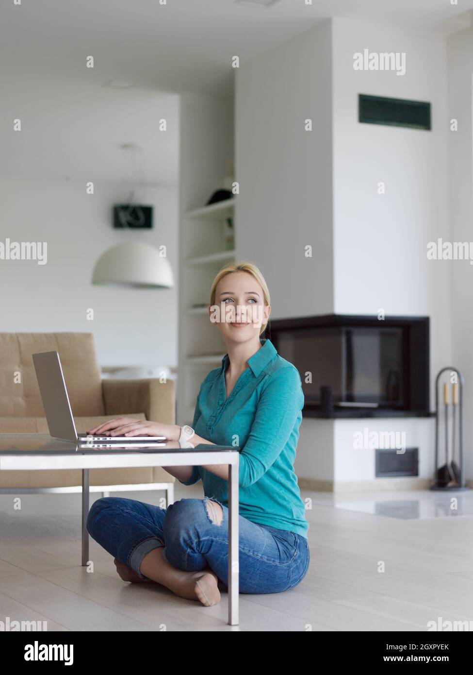 beautiful young women using laptop computer on the floor of her luxury ...