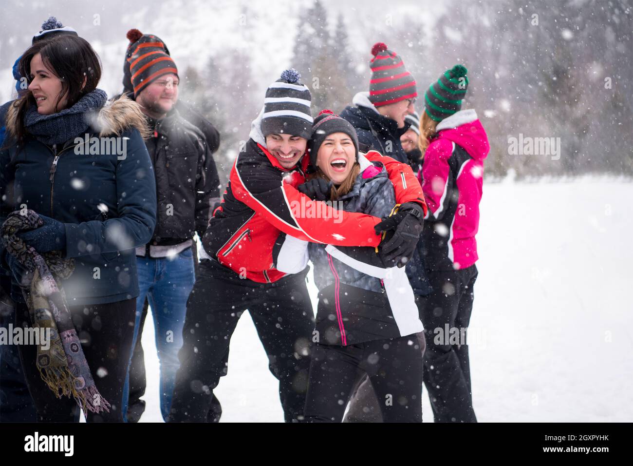 group portrait of young happy business people enjoying snowy winter day ...