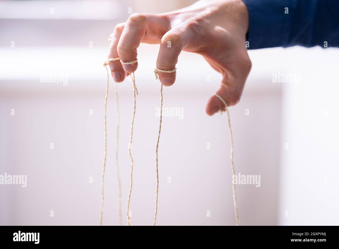 Manipulating Marionette Puppet Strings By Hand. Business Power Stock ...