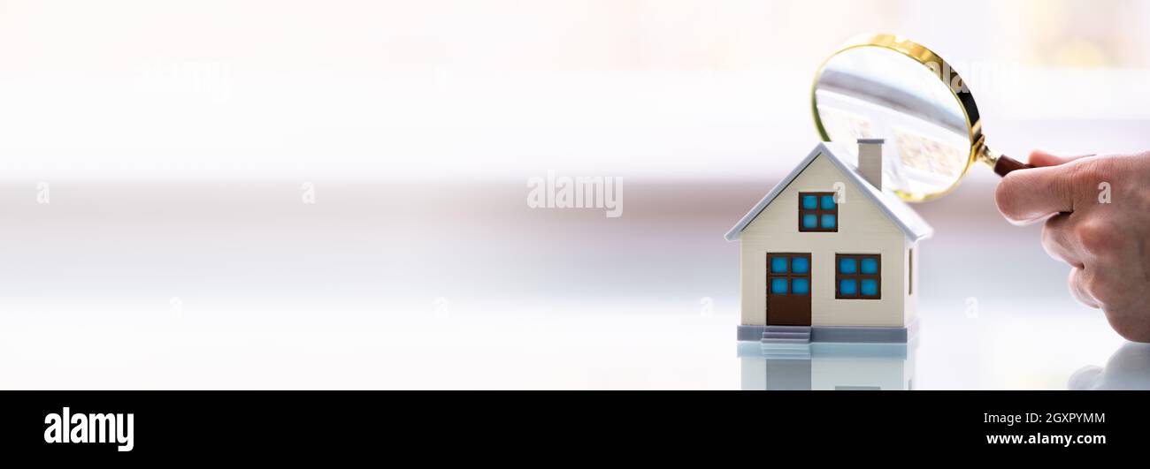 Real Estate House Inspector Checking Property Using Magnifying Glass ...