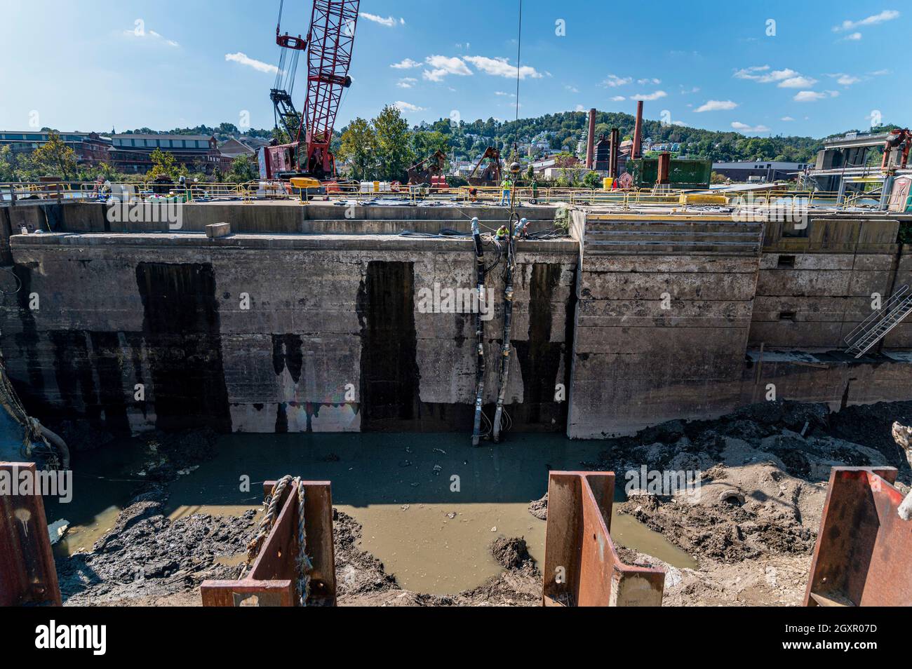 Contractors pump water out of the newly-constructed lock chamber at ...