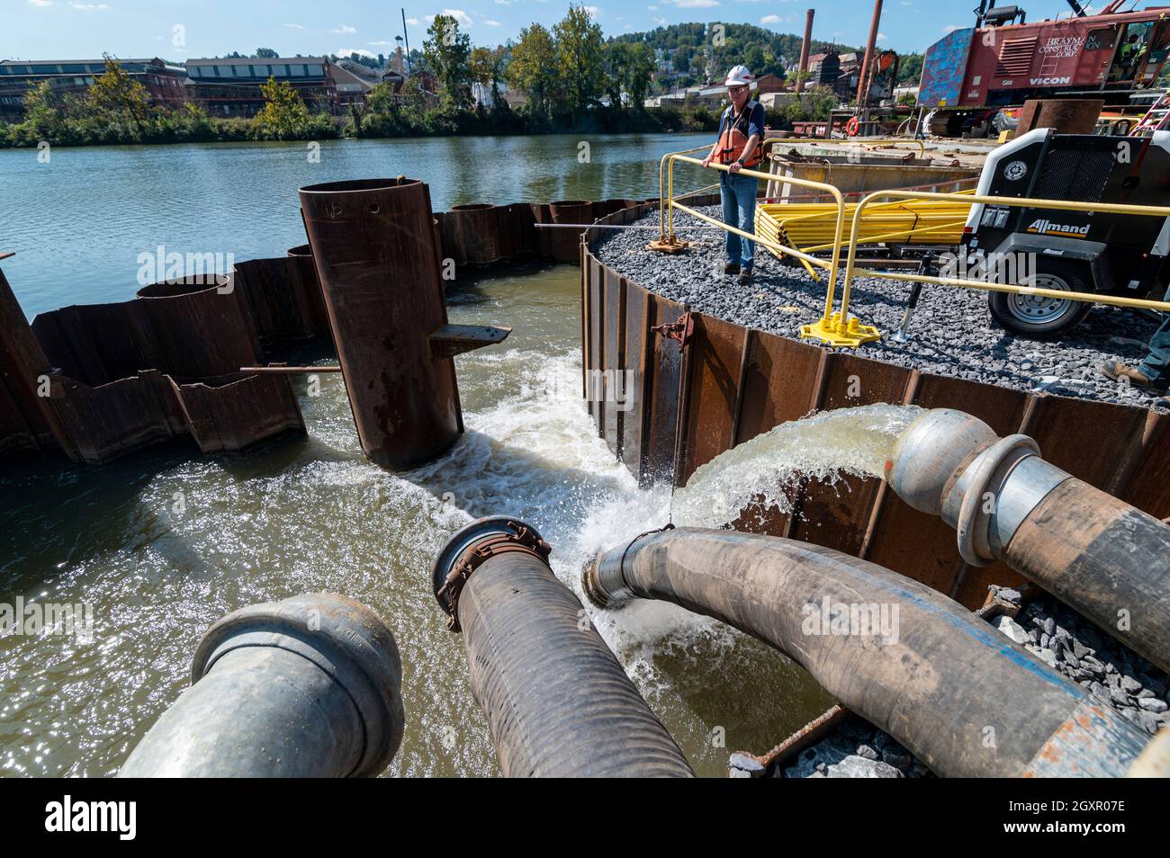 Contractors pump water out of the newly-constructed lock chamber at ...