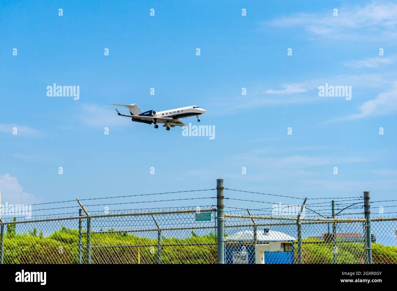 Santa Ana, CA, USA – August 16, 2021: A private jet airplane flying low ...