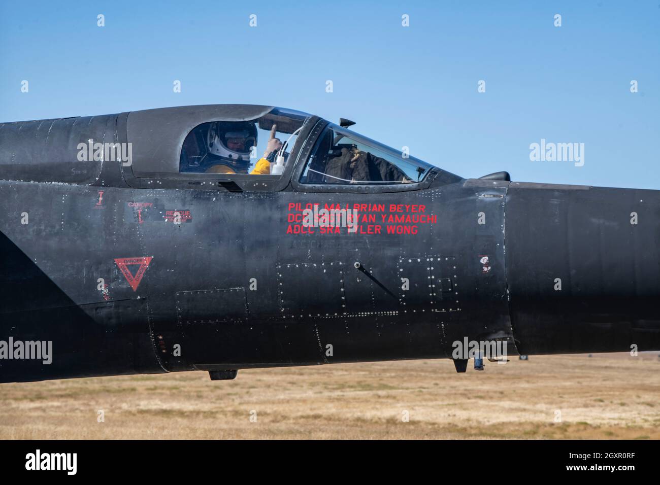 Lt. Col. Joshua, 1st Reconnaissance Squadron instructor pilot, signals ...