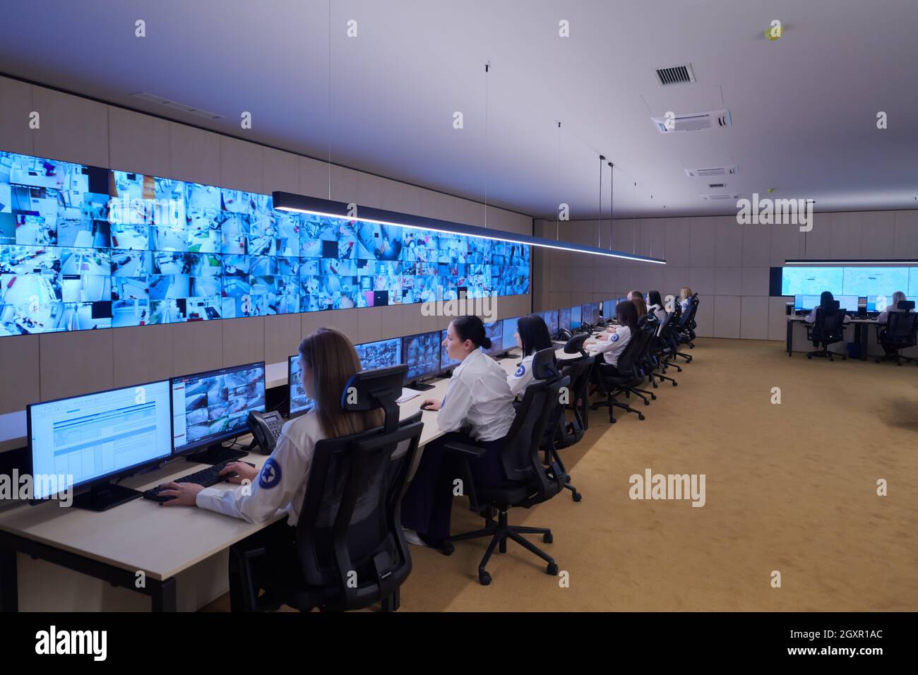 Group of Security data center operators working in a CCTV monitoring ...