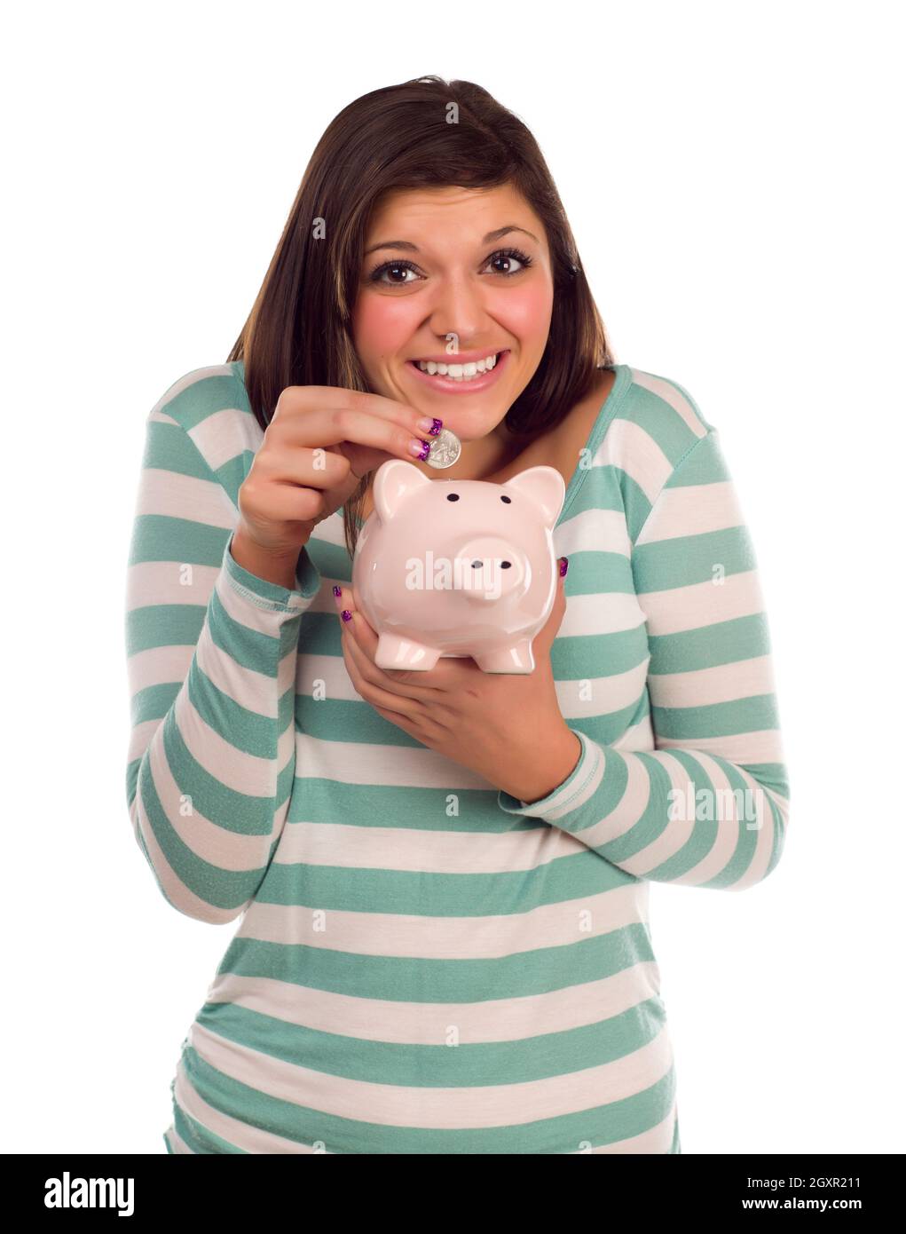 Pretty Smiling Ethnic Female Putting a Coin Into Her Pink Piggy Bank ...