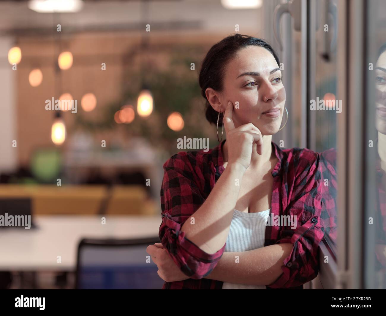 casual business woman portrait as influencer in open space coworking ...