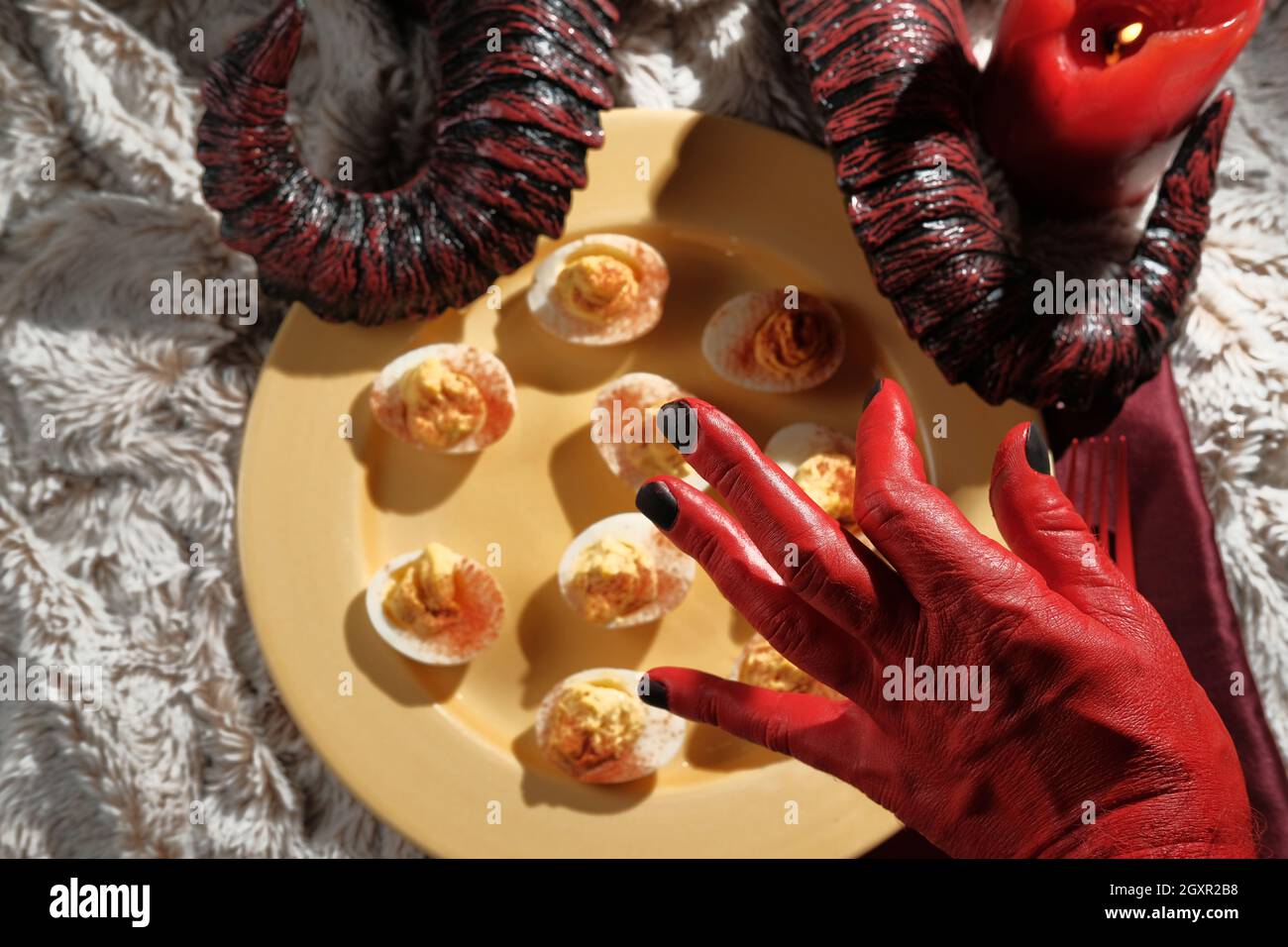 Satans recipe hellish deviled eggs with horns Stock Photo - Alamy