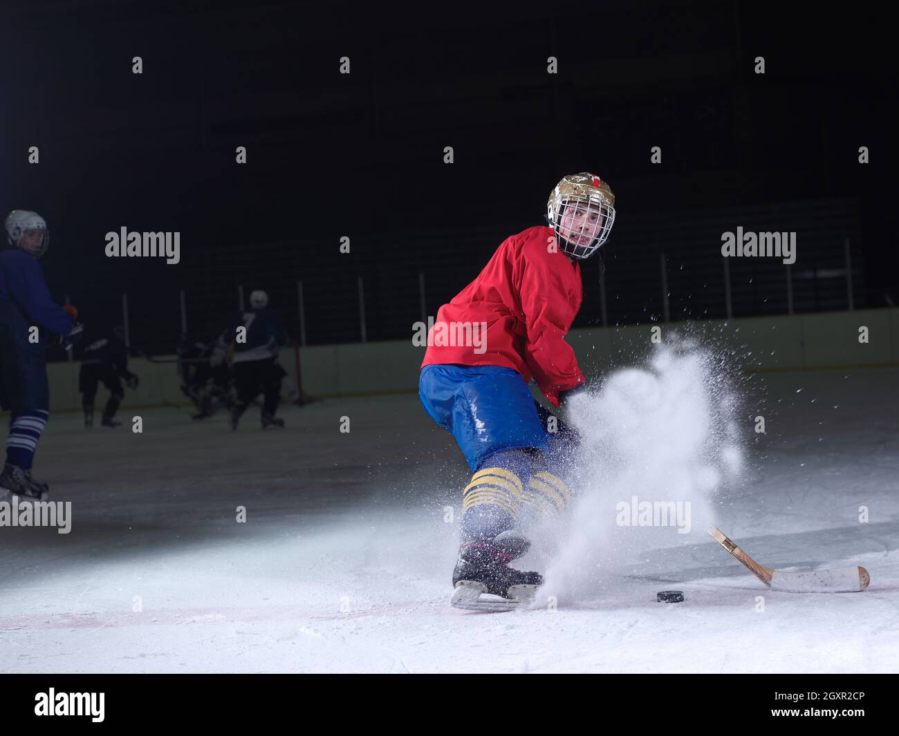 ice hockey player in action kicking with stick Stock Photo - Alamy