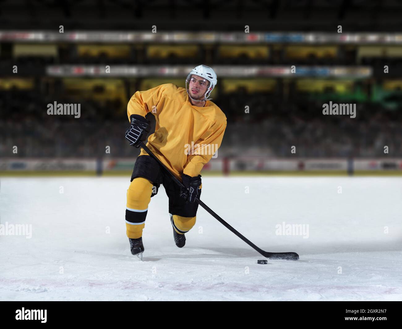 ice hockey player in action kicking with stick Stock Photo - Alamy