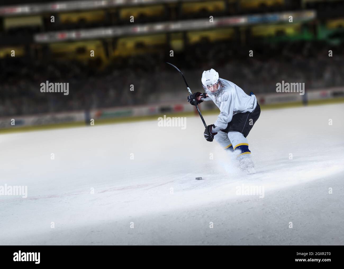 ice hockey player in action kicking with stick Stock Photo - Alamy