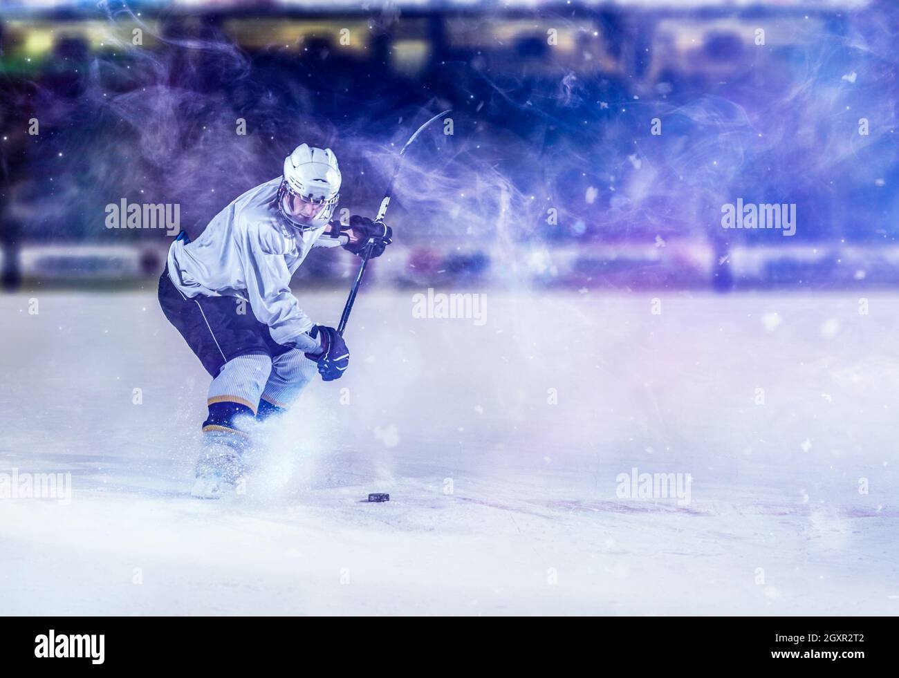 ice hockey player in action kicking with stick Stock Photo - Alamy
