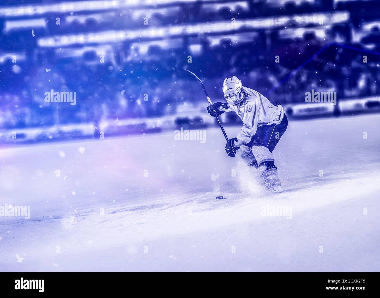 ice hockey player in action kicking with stick Stock Photo - Alamy