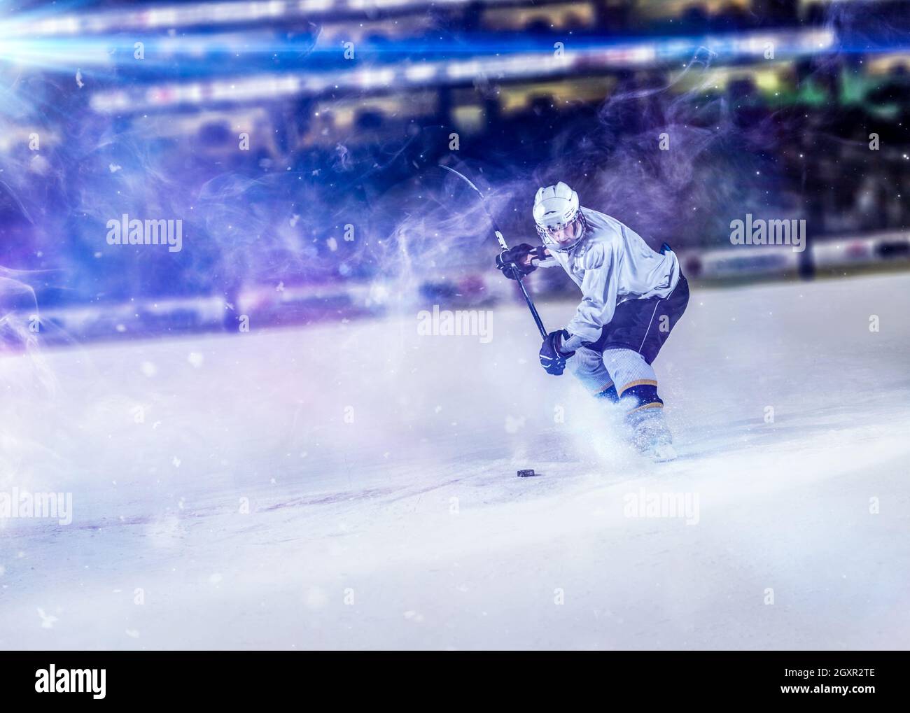 ice hockey player in action kicking with stick Stock Photo - Alamy