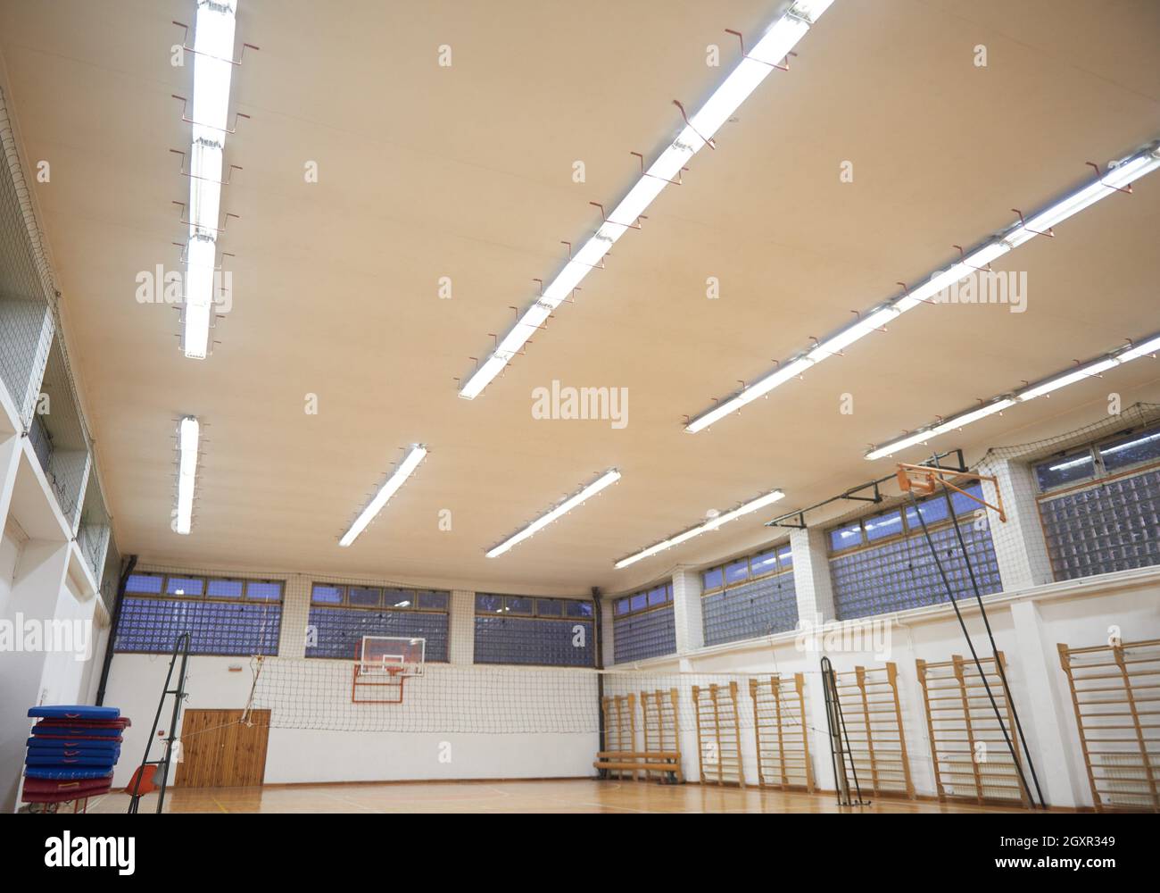 elementary school gym indoor with volleyball net Stock Photo - Alamy
