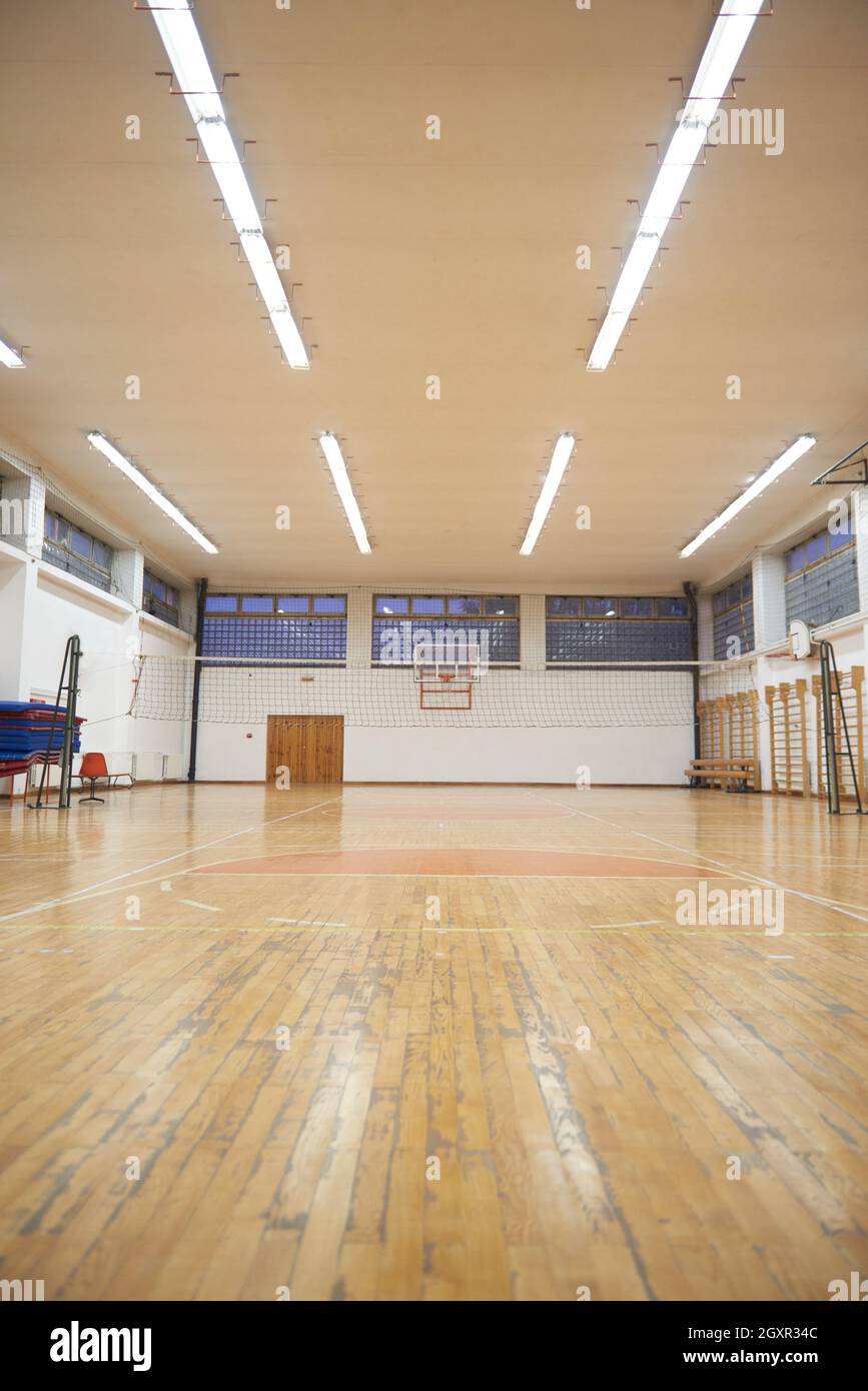 elementary school gym indoor with volleyball net Stock Photo - Alamy
