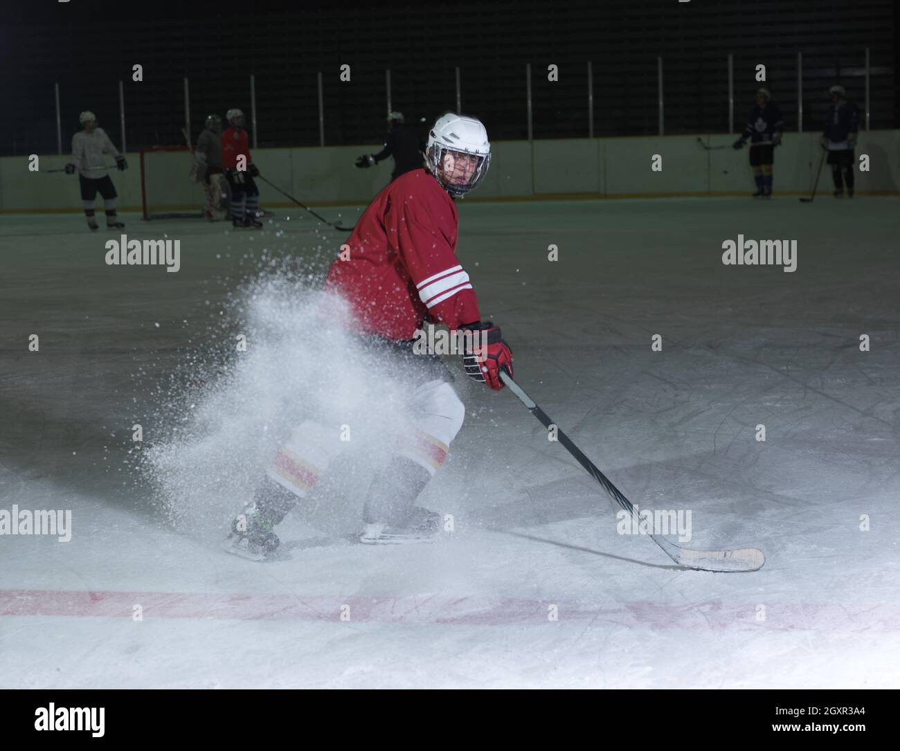 ice hockey player in action kicking with stick Stock Photo - Alamy