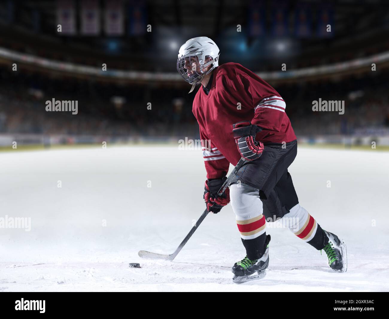 ice hockey player in action kicking with stick Stock Photo - Alamy