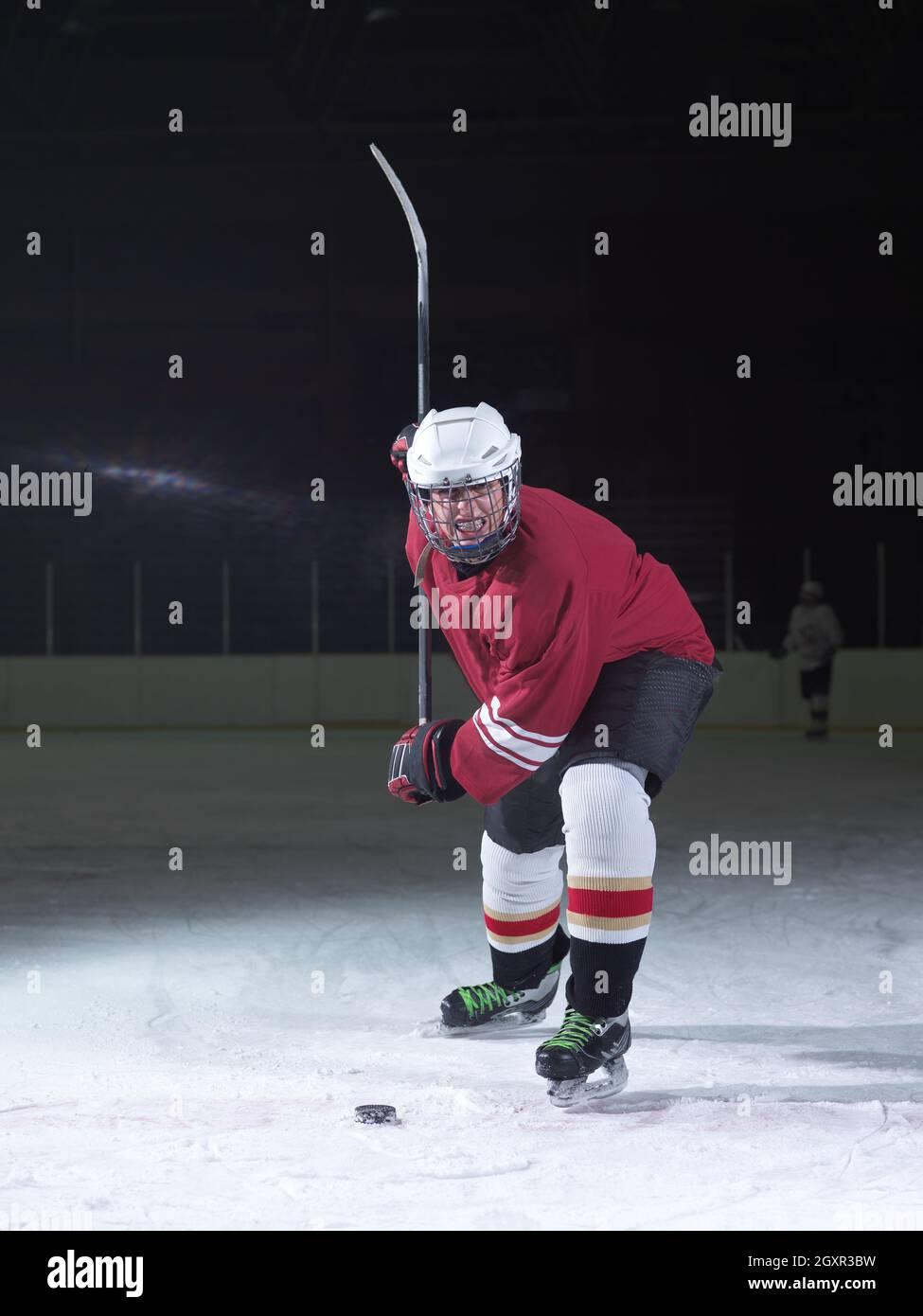 ice hockey player in action kicking with stick Stock Photo - Alamy