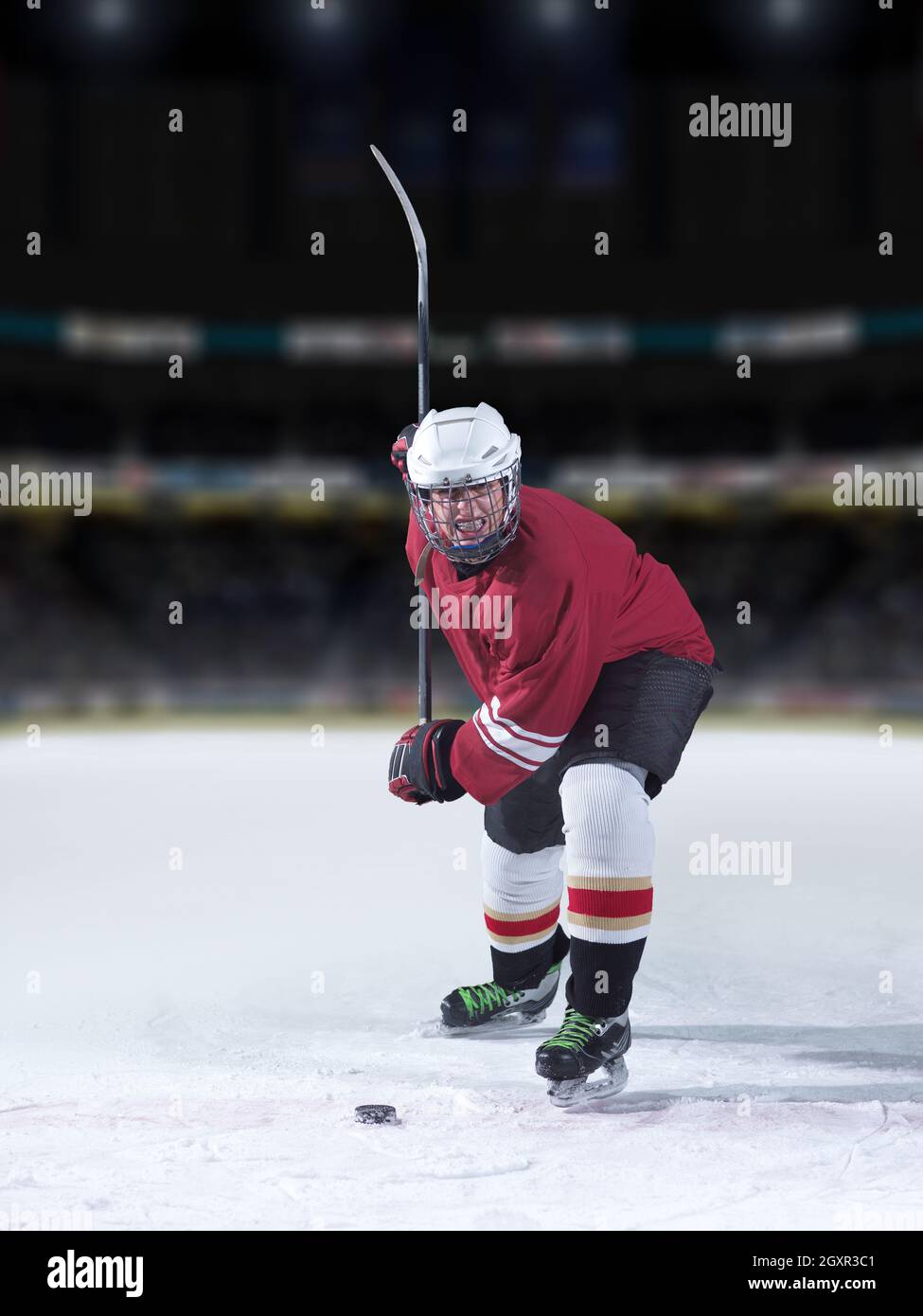 ice hockey player in action kicking with stick Stock Photo - Alamy