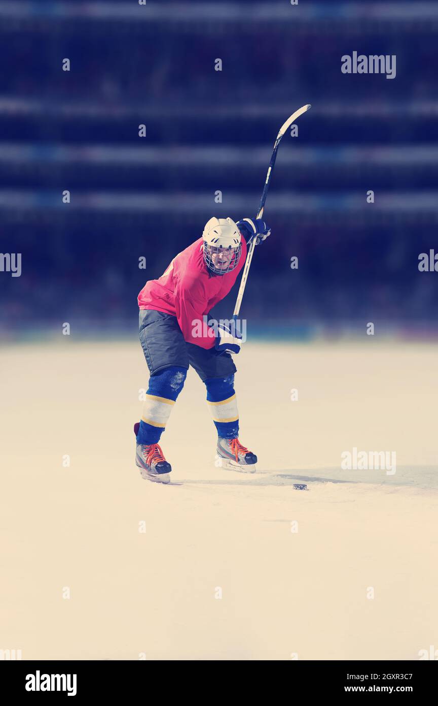 ice hockey player in action kicking with stick Stock Photo - Alamy