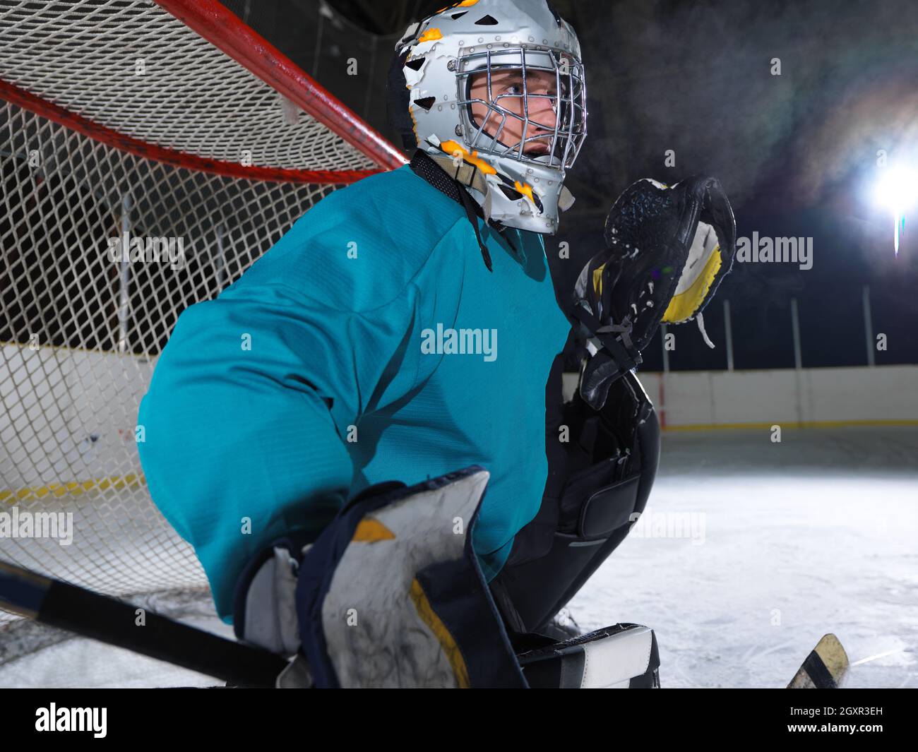 ice hockey goalkeeper player on goal in action Stock Photo - Alamy