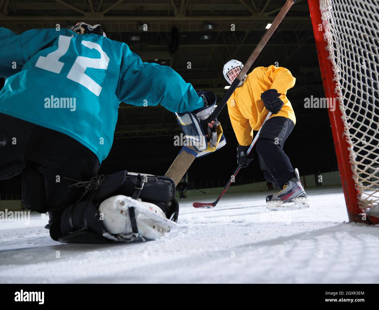 ice hockey goalkeeper player on goal in action Stock Photo - Alamy