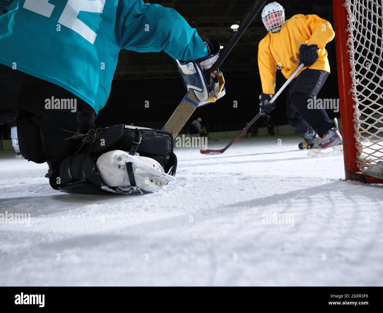 ice hockey goalkeeper player on goal in action Stock Photo - Alamy