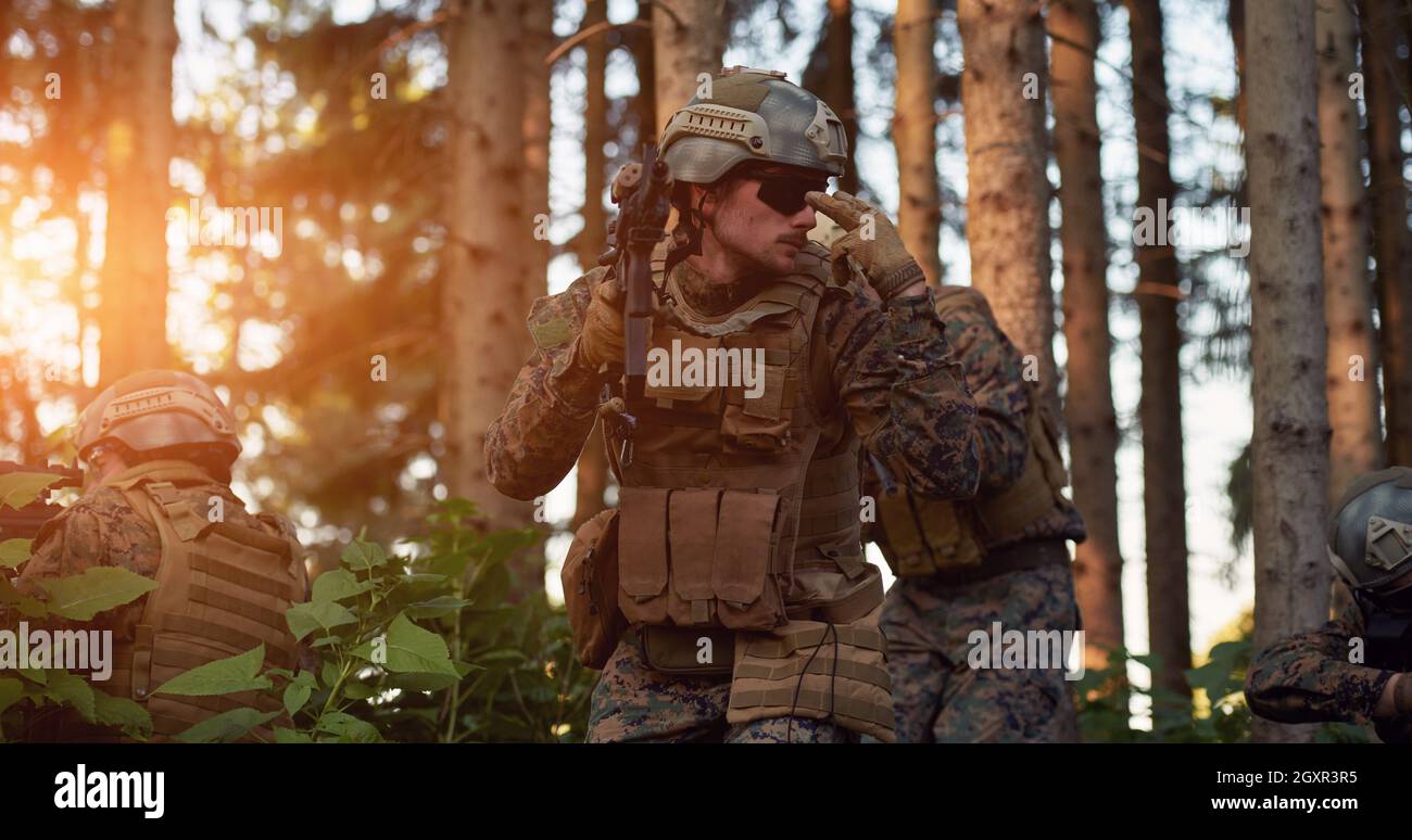 modern warfare soldier officer is showing tactical hand signals to ...