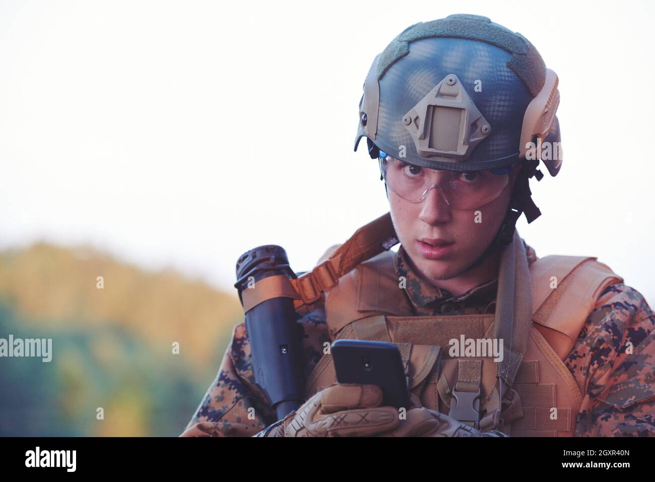 soldier using smart phone to contact family or girlfriend communication ...