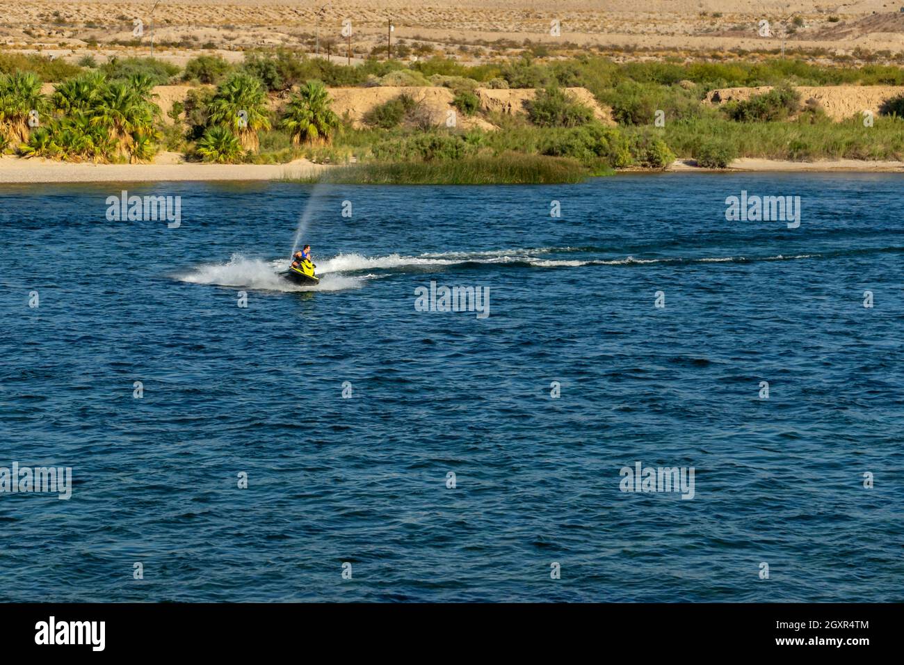 Laughlin, NV, USA – August 27, 2021: A man riding a yellow jet ski on ...