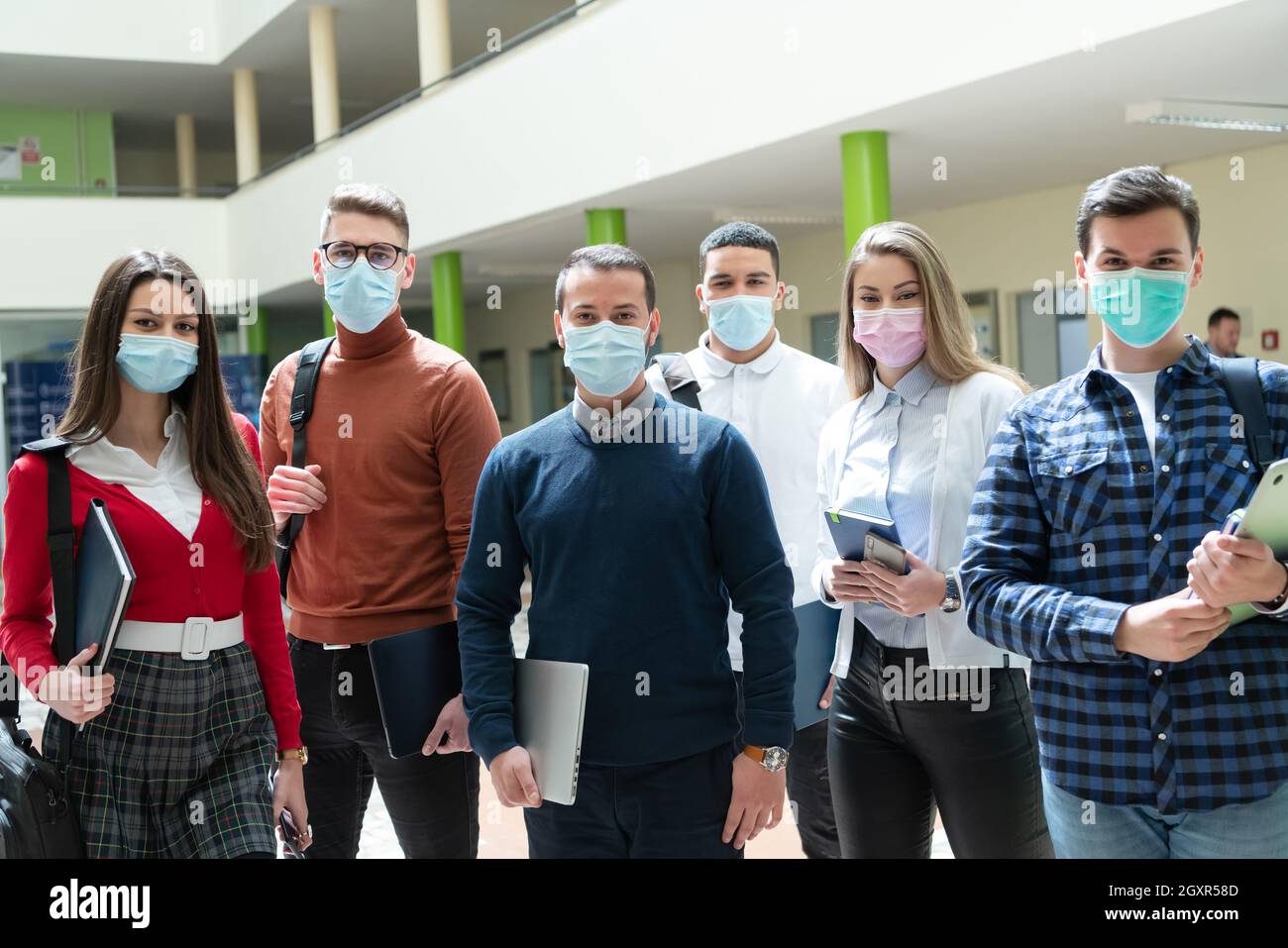 Multiethnic students group wearing protective face mask at university ...