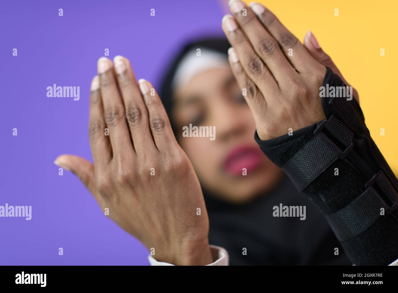 Modern African Muslim woman makes traditional prayer to God, keeps ...