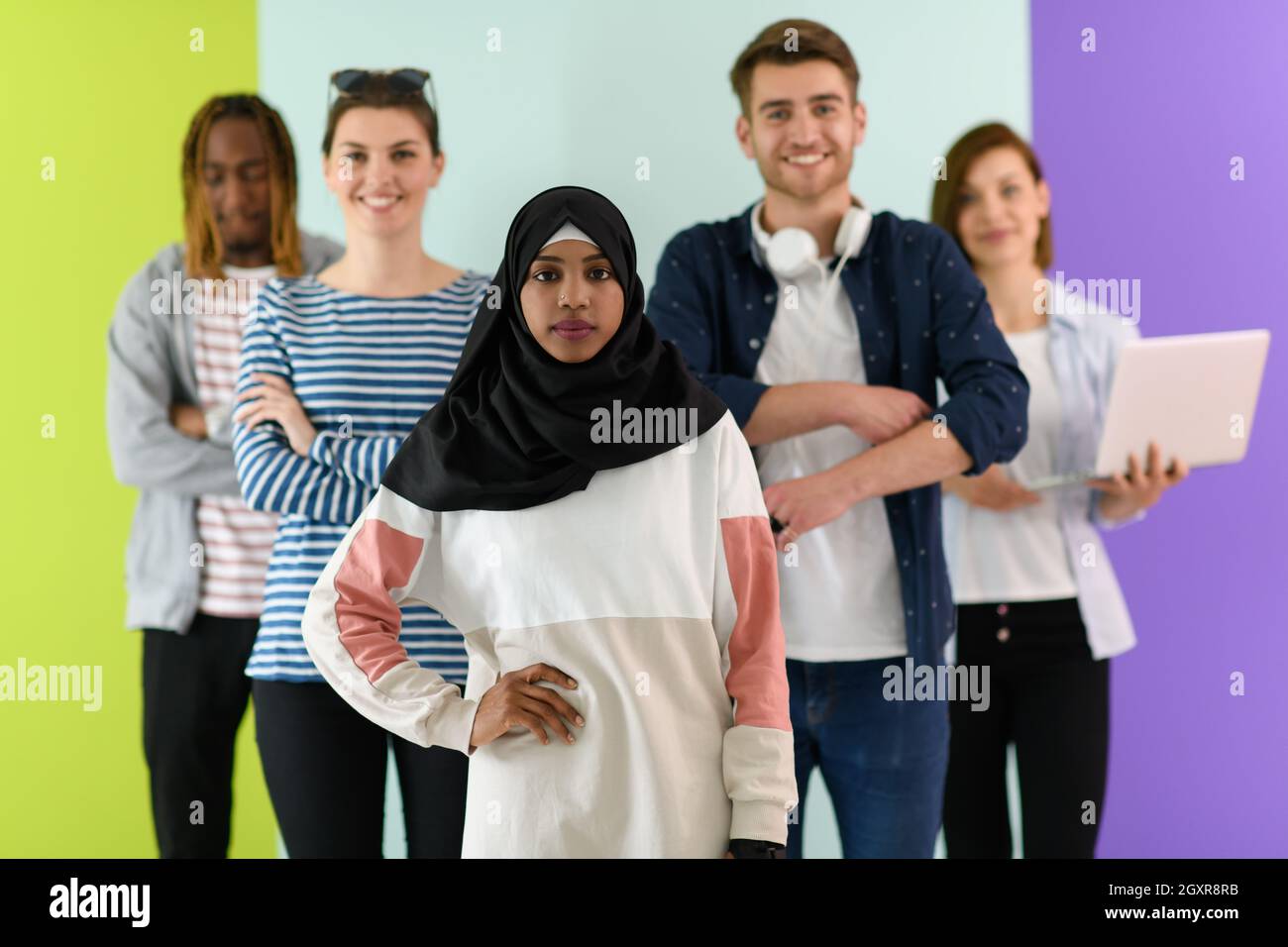 a group of diverse teenagers posing in a studio, determined teenagers ...